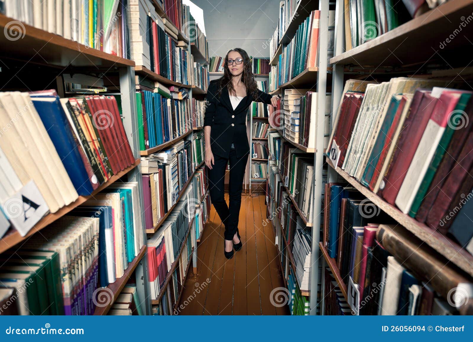 Brunette woman at library stock photo. Image of adult - 26056094