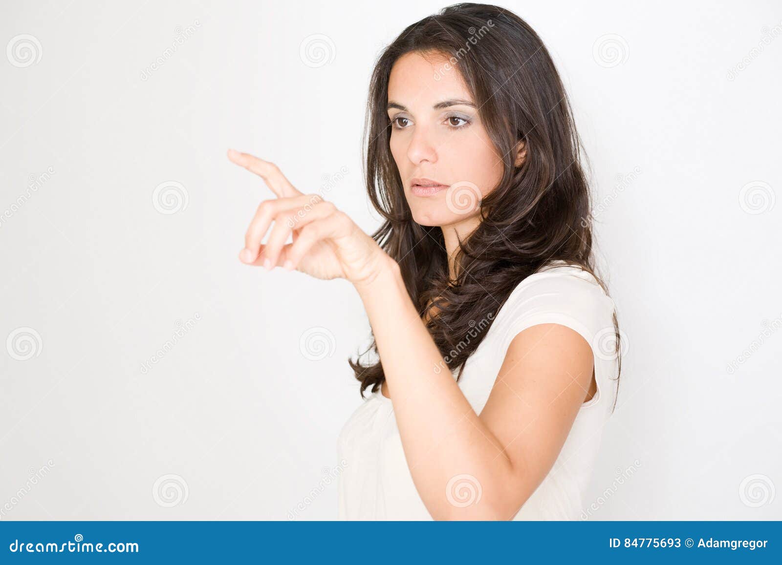 Brunette Woman Pointing on a Virtual Screen Stock Image - Image of ...
