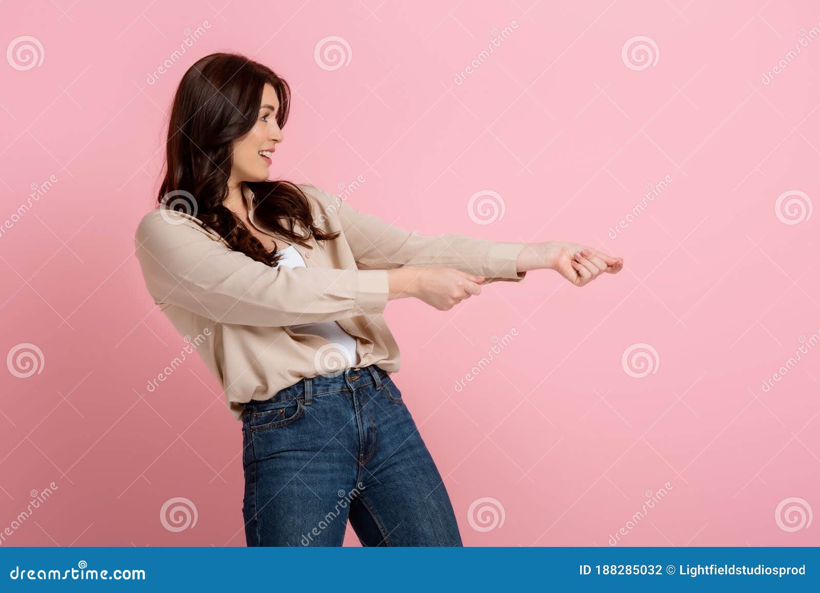 Brunette Woman Pulling Something Isolated on Stock Photo - Image of ...