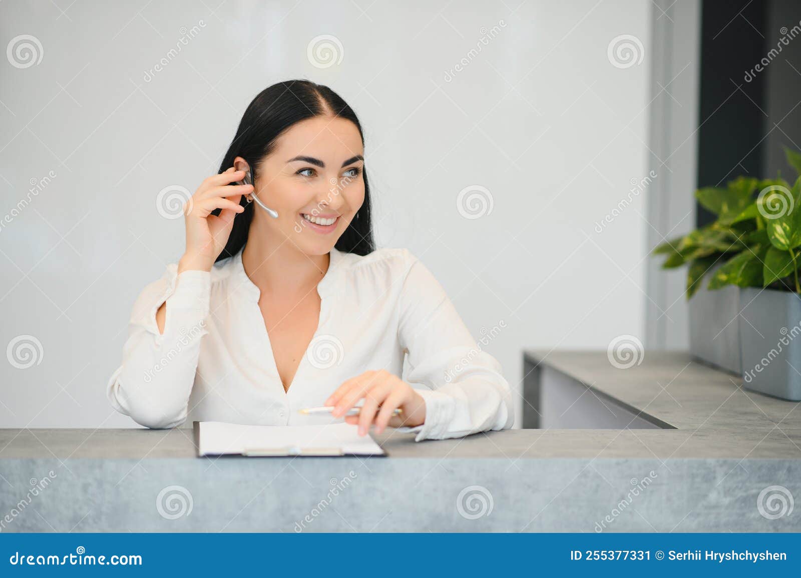 Brunette Woman Receptionist Working in Reception of the Beauty Salon ...