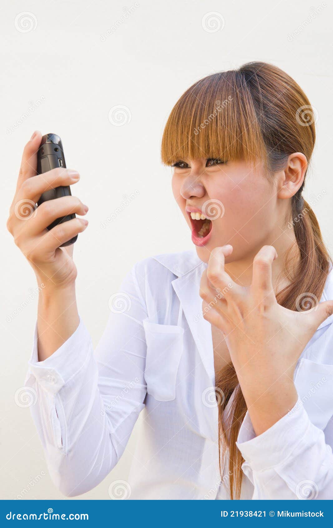 Brunette Woman Screaming at Phone Stock Image - Image of caucasian ...