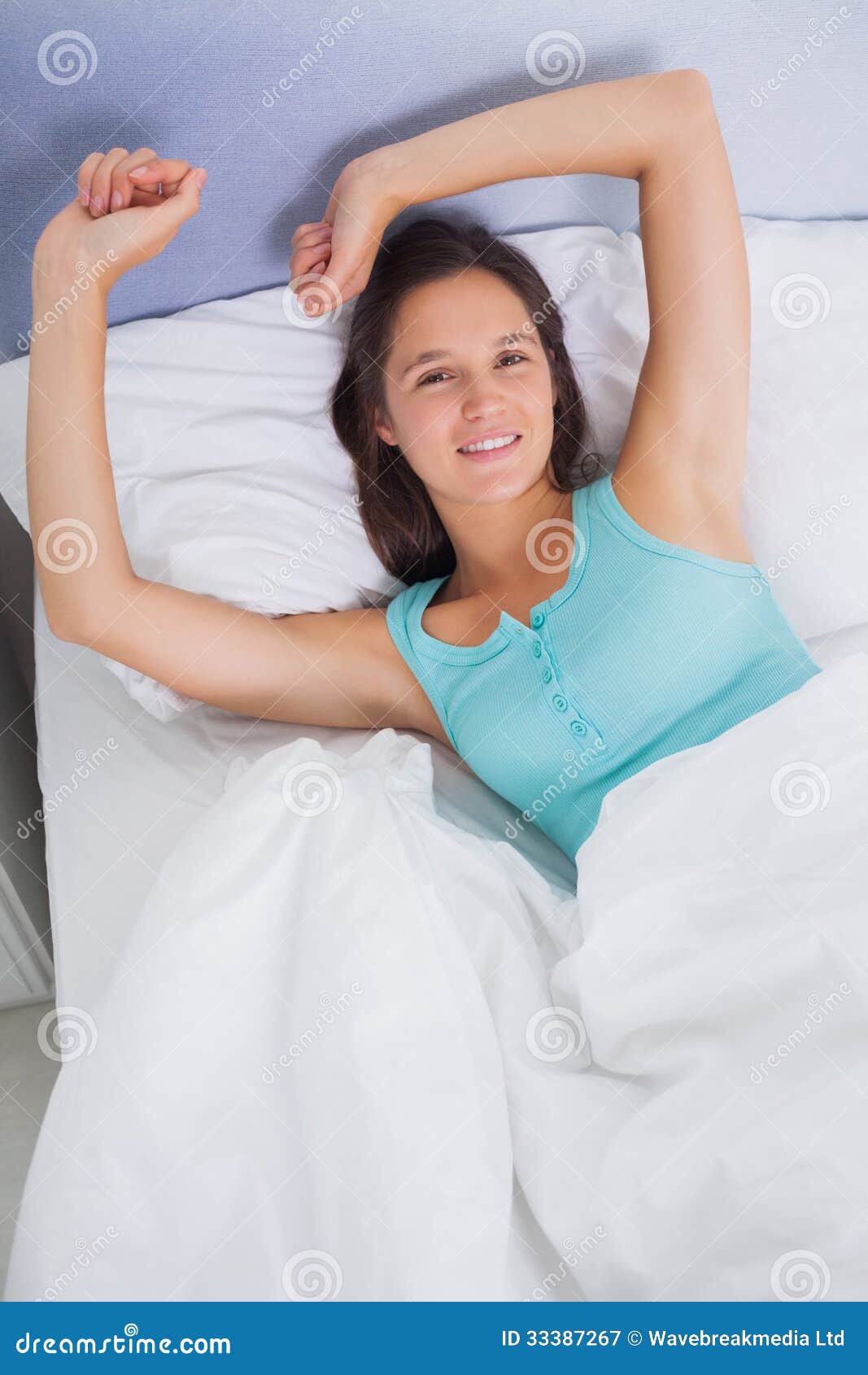 Brunette Woman Stretching And Smiling In Bed Stock Image Image Of