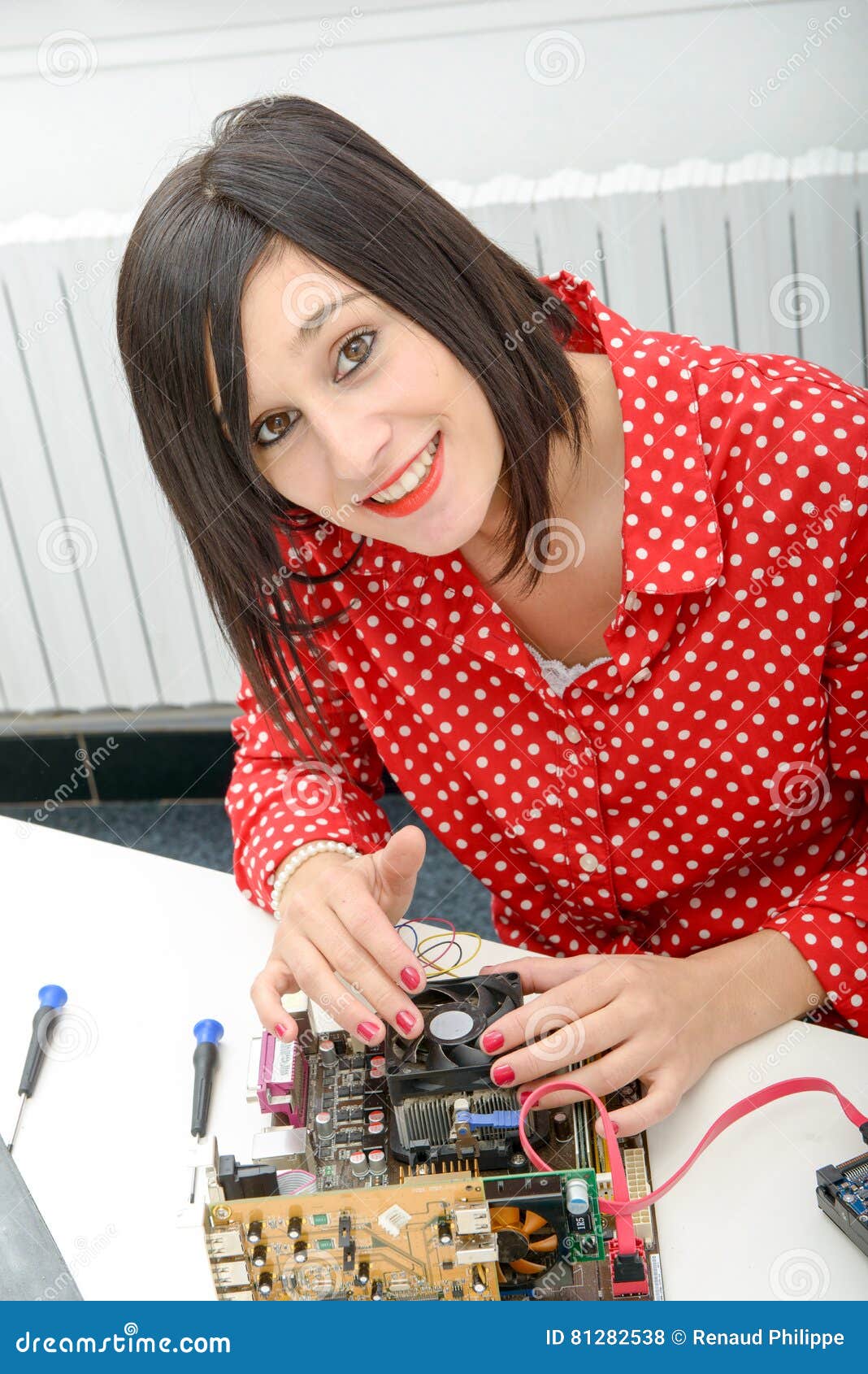Brunette Woman Technician Repairs a Computer Stock Photo - Image of ...