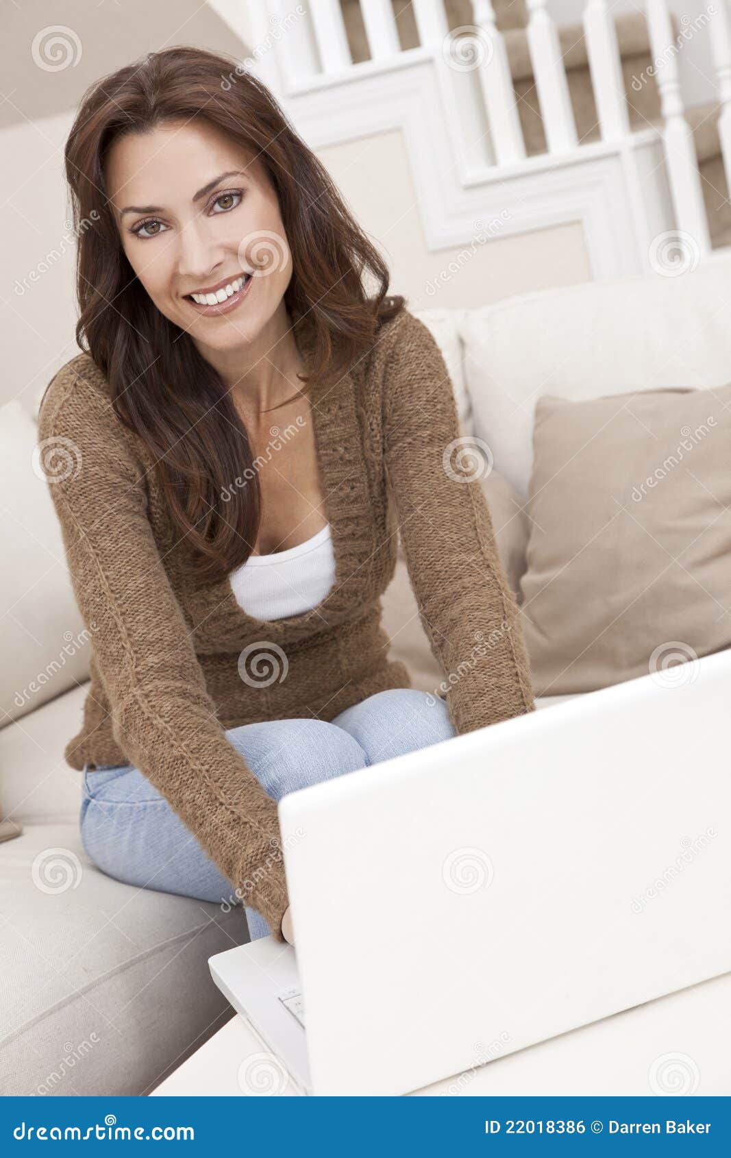 Brunette Woman Using Laptop Computer at Home Stock Photo - Image of ...