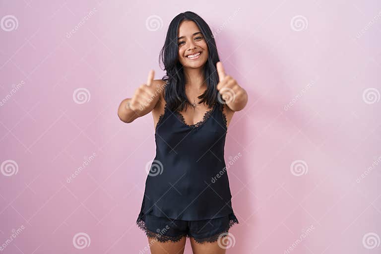 Brunette Woman Wearing Black Pajama Approving Doing Positive Gesture