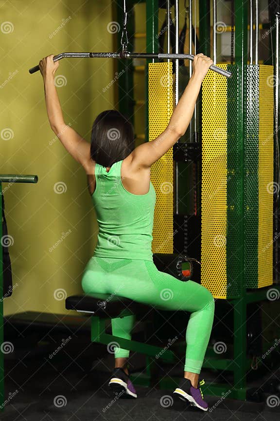 Lat Pulldown Machine Woman Workout at Gym Stock Photo - Image of energy ...