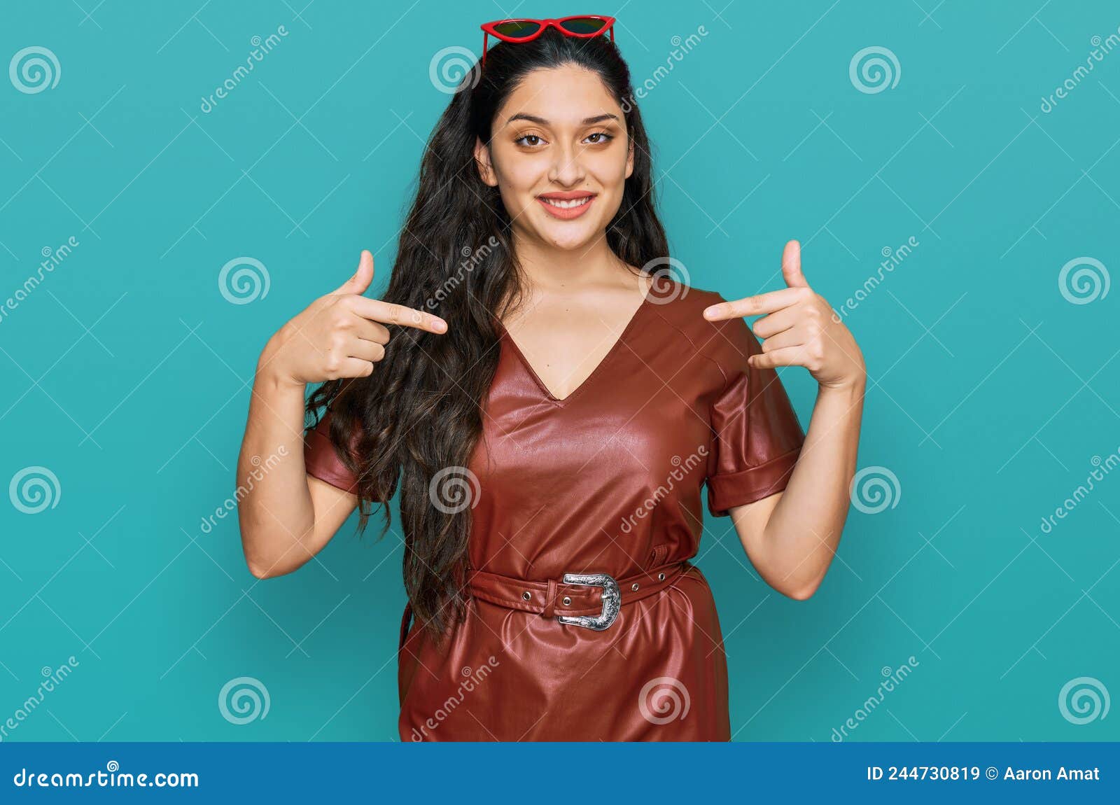 Brunette Young Woman Wearing Dress And Sunglasses Looking Confident
