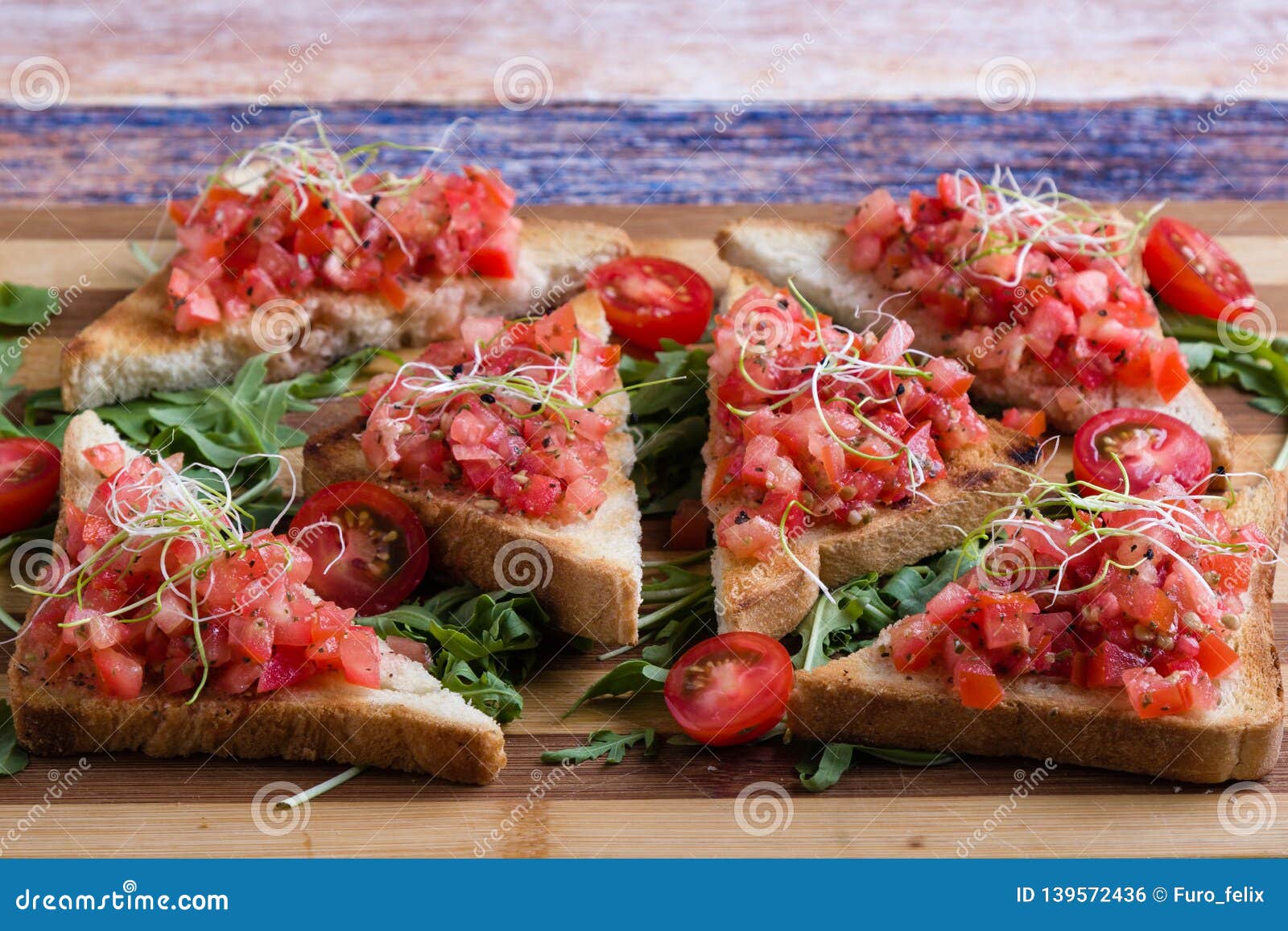 Bruschetta with Tomato Basil and Rucola Stock Photo - Image of tomato ...