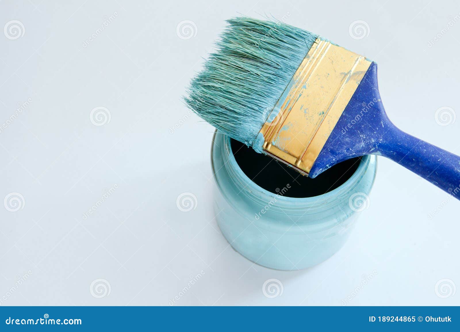 Brush and Blue Paint Jar with a Close-up on a White Background Stock ...