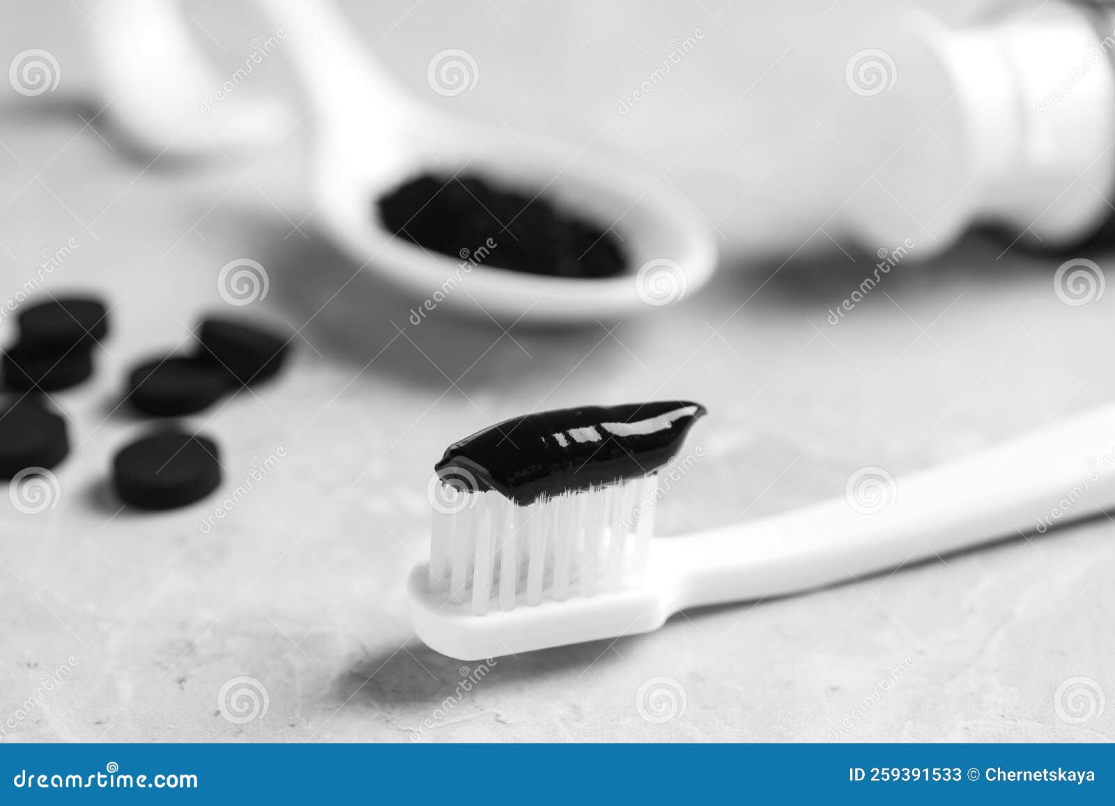 Brush with Charcoal Toothpaste on Light Grey Table, Closeup Stock Image ...