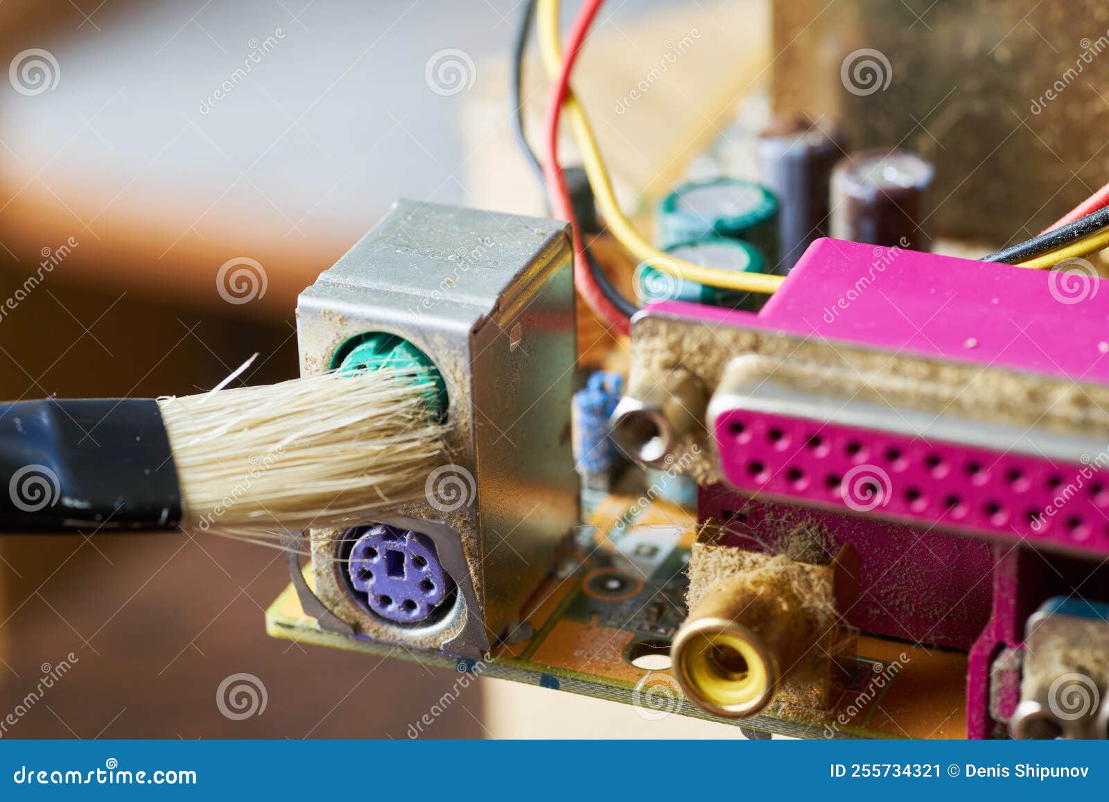 Brush Cleaning an Old Computer Board from Dust and Dirt. Close-up ...