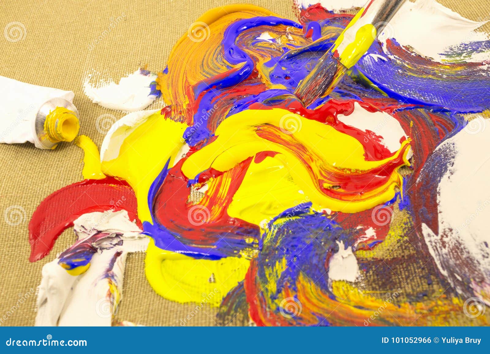 Brush Mixing Paint on Canvas Stock Photo - Image of closeup, blue ...