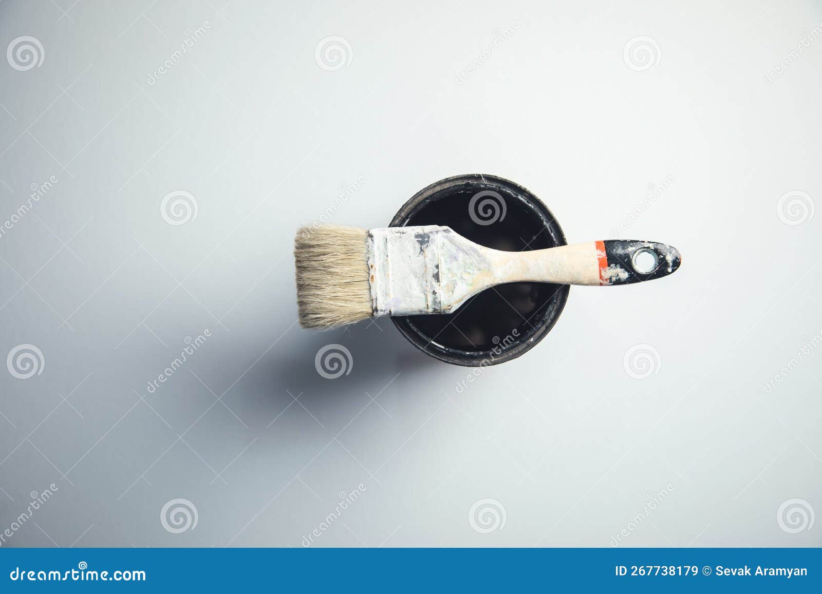 Brush on the paint bowl stock image. Image of closeup - 267738179