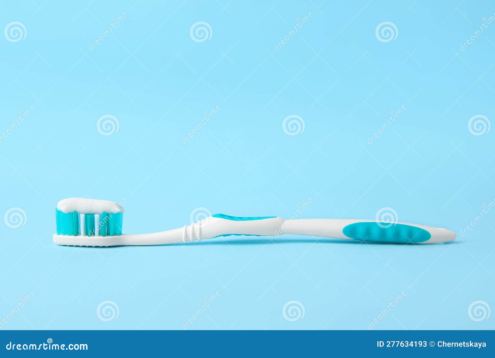 Brush with Toothpaste on Light Blue Background, Space for Text Stock ...