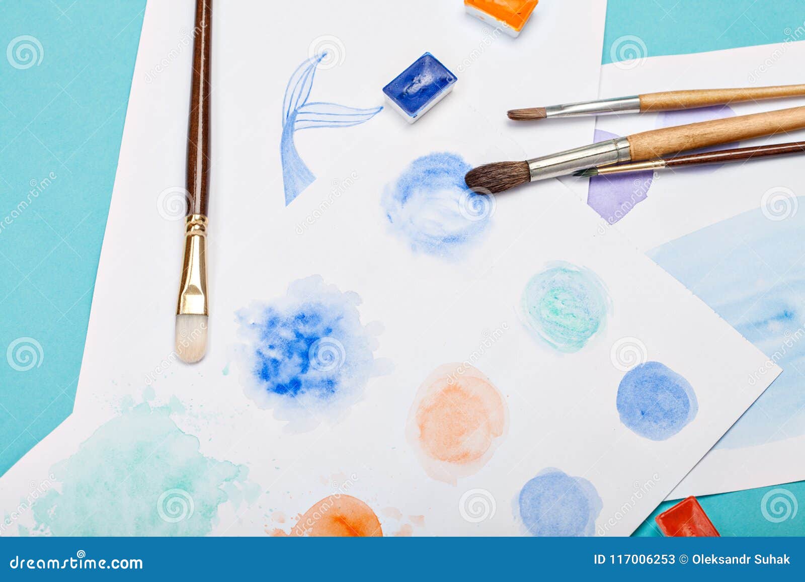 Brushes, Paints and Drawings on Paper on Blue Background Stock Image ...