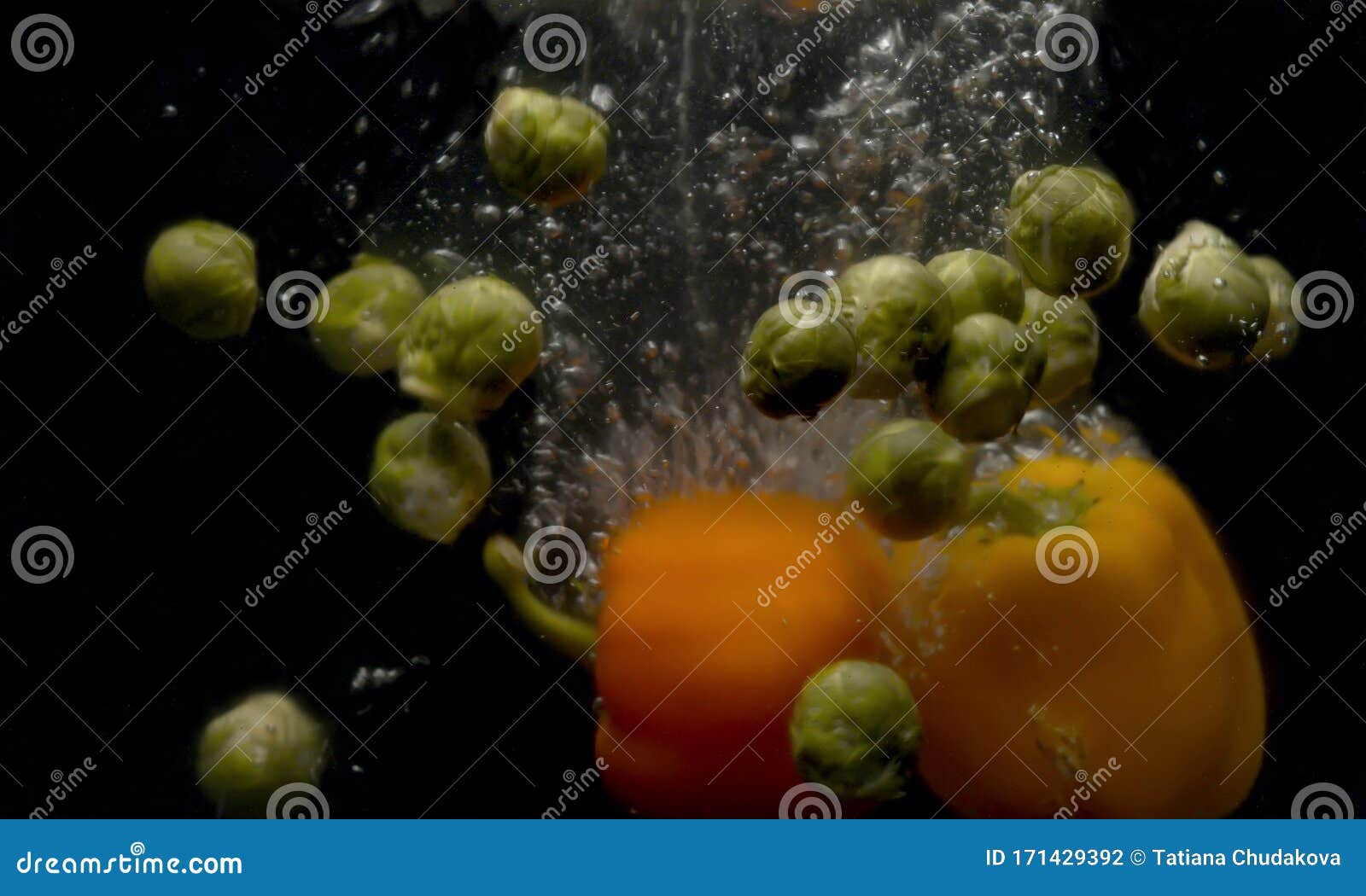 Brussels Sprouts and Paprika Falling into the Water with a Splash and ...