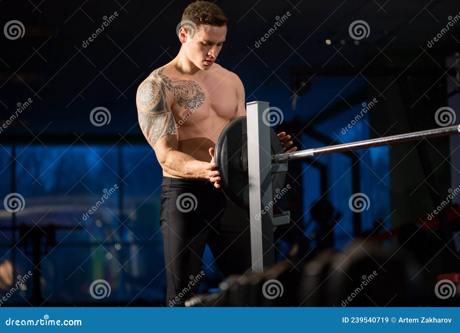 Brutal Athletic Man Pumping Up Muscles on Bench Press. Stock Image ...