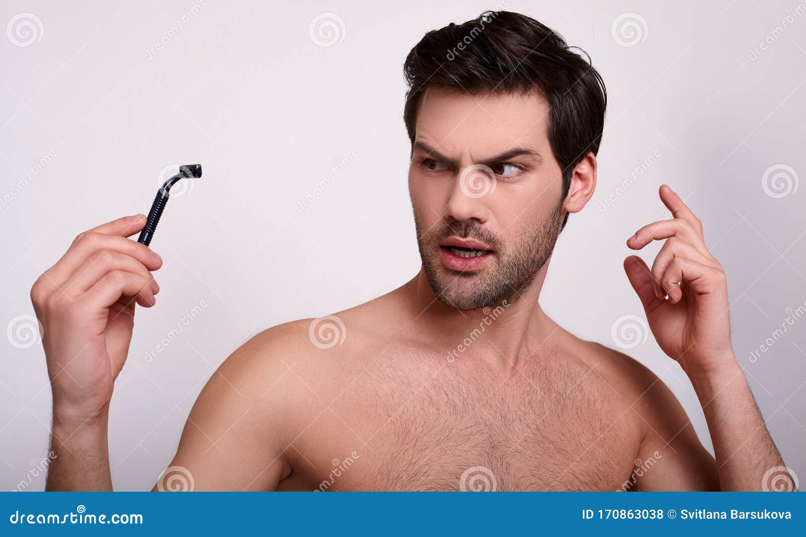Brutal Brooding Man Thinks To Shave, Holds Razor. Copy Space Stock ...