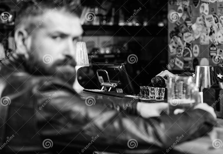 Brutal Hipster Bearded Man Sit at Bar Counter Drink Beer. Friday ... Brutal Hipster Bearded Man Sit at Bar Counter Drink Beer. Friday ...