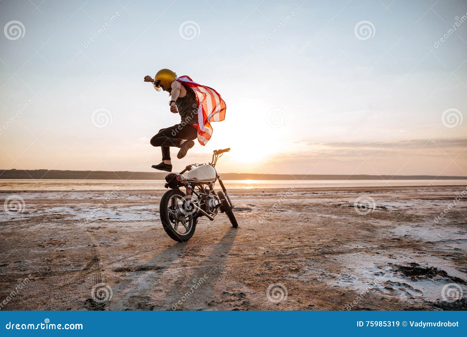 Brutal Man Jumping Over His Motorcycle at the Sunset Stock Image ...