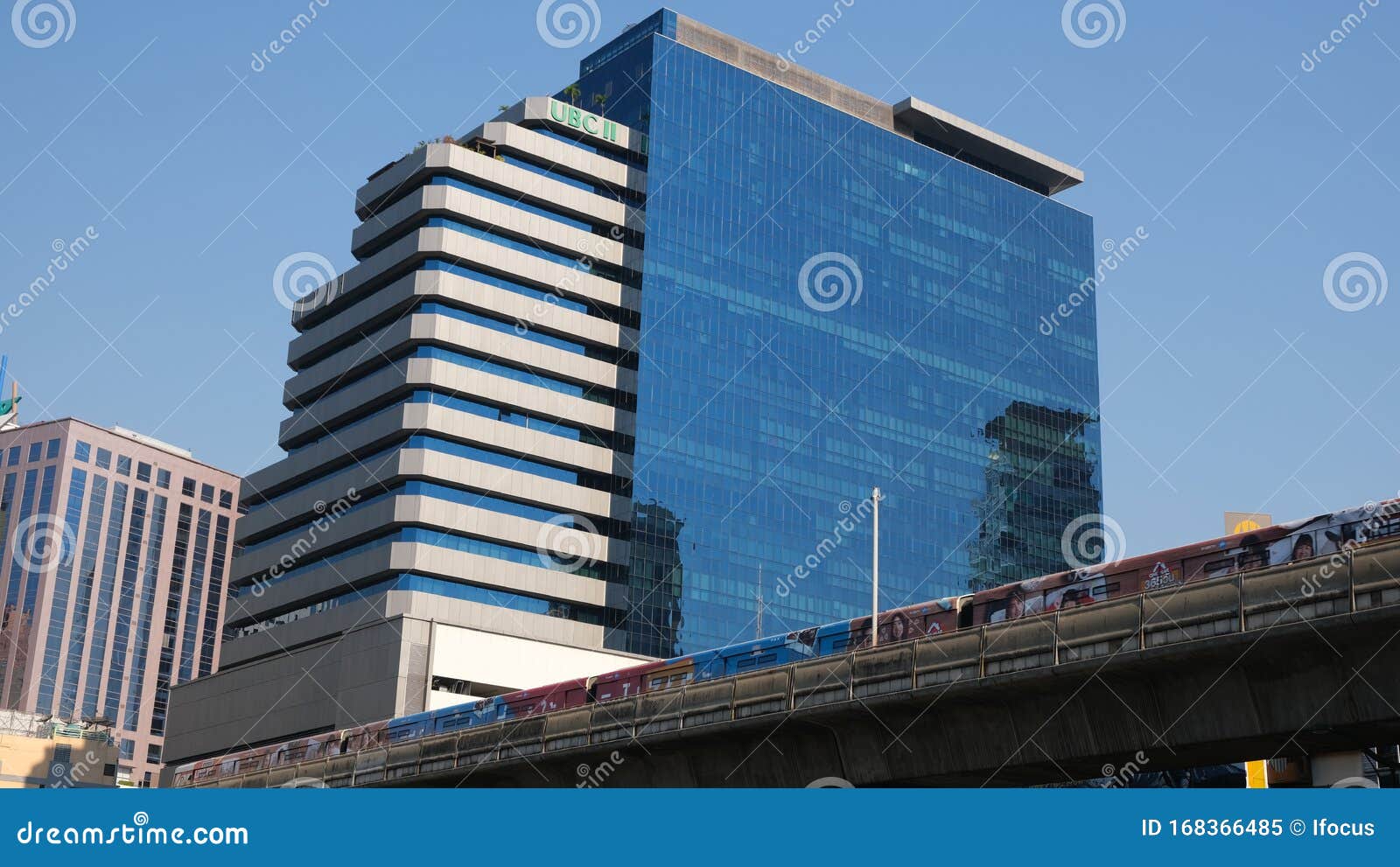BTS Skytrain Passes in Front of a Modern Building Editorial Image ...