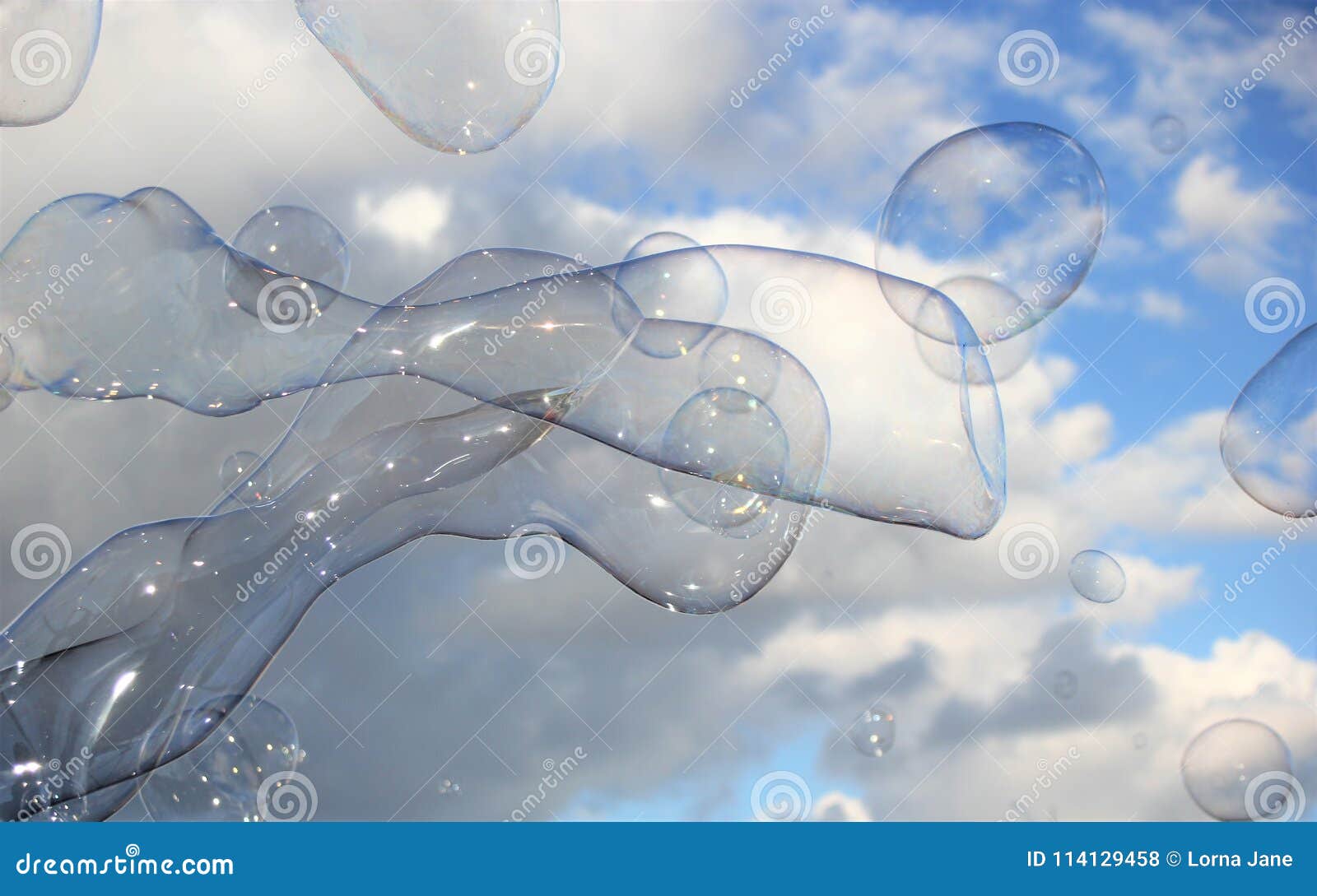 Bubble Bubbles Floating Soap Drift In Blue Sky With Clouds Stock ...