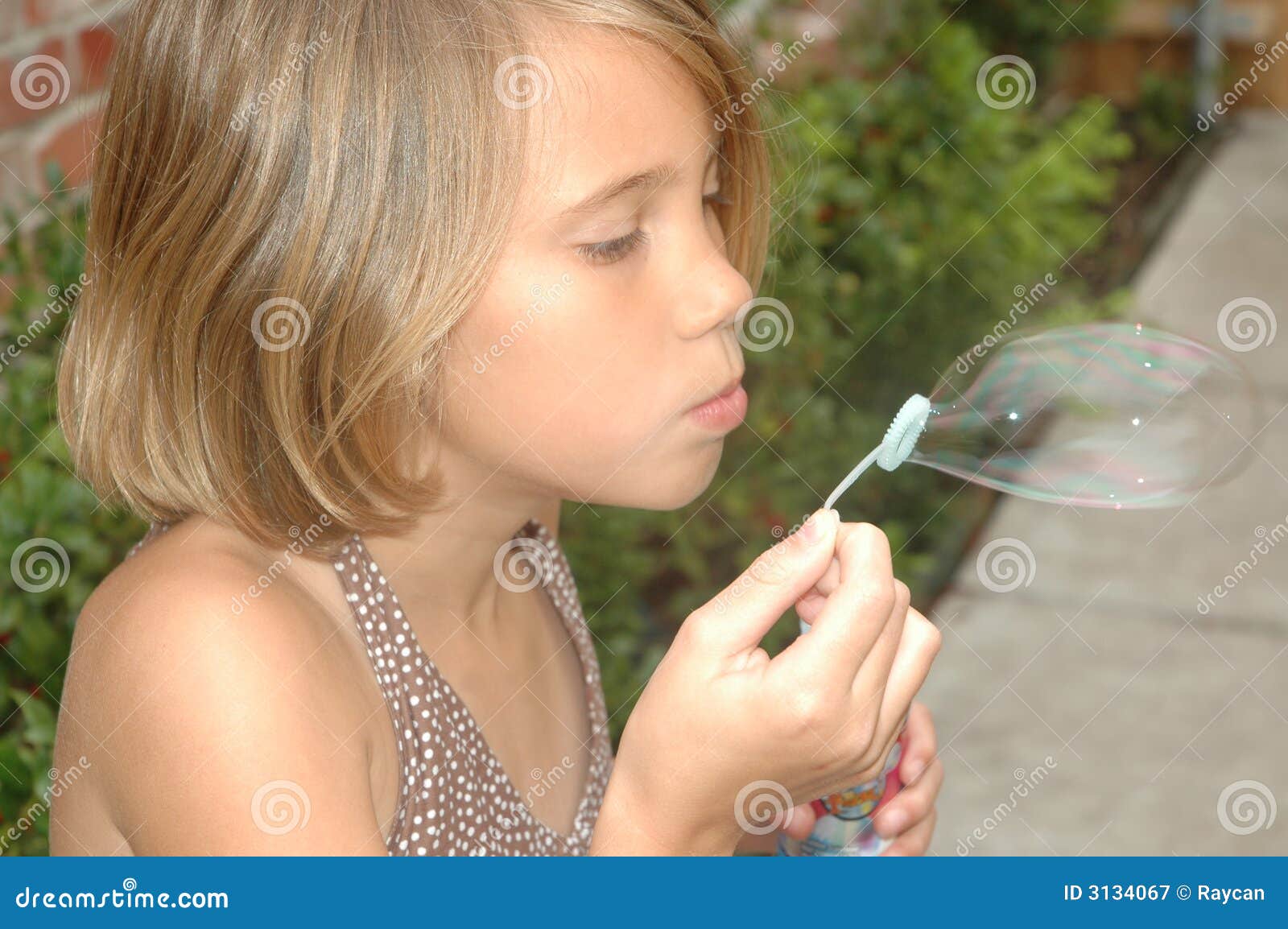 Bubbles in Action stock image. Image of blowing, girl - 3134067