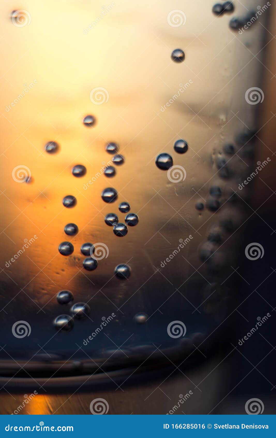 Bubbles in a Glass at Sunset Stock Photo - Image of liquid, drops ...