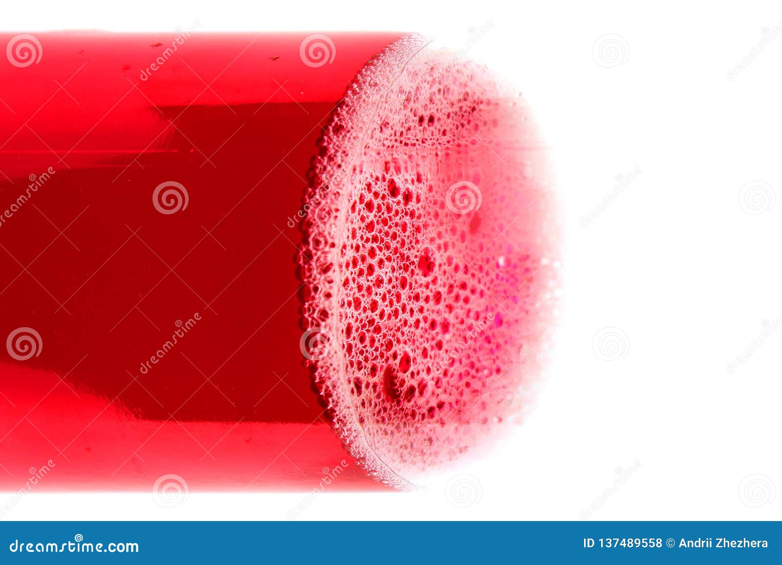 Bubbles on Surface of Congealed Red Liquid in a Bottle Stock Photo ...