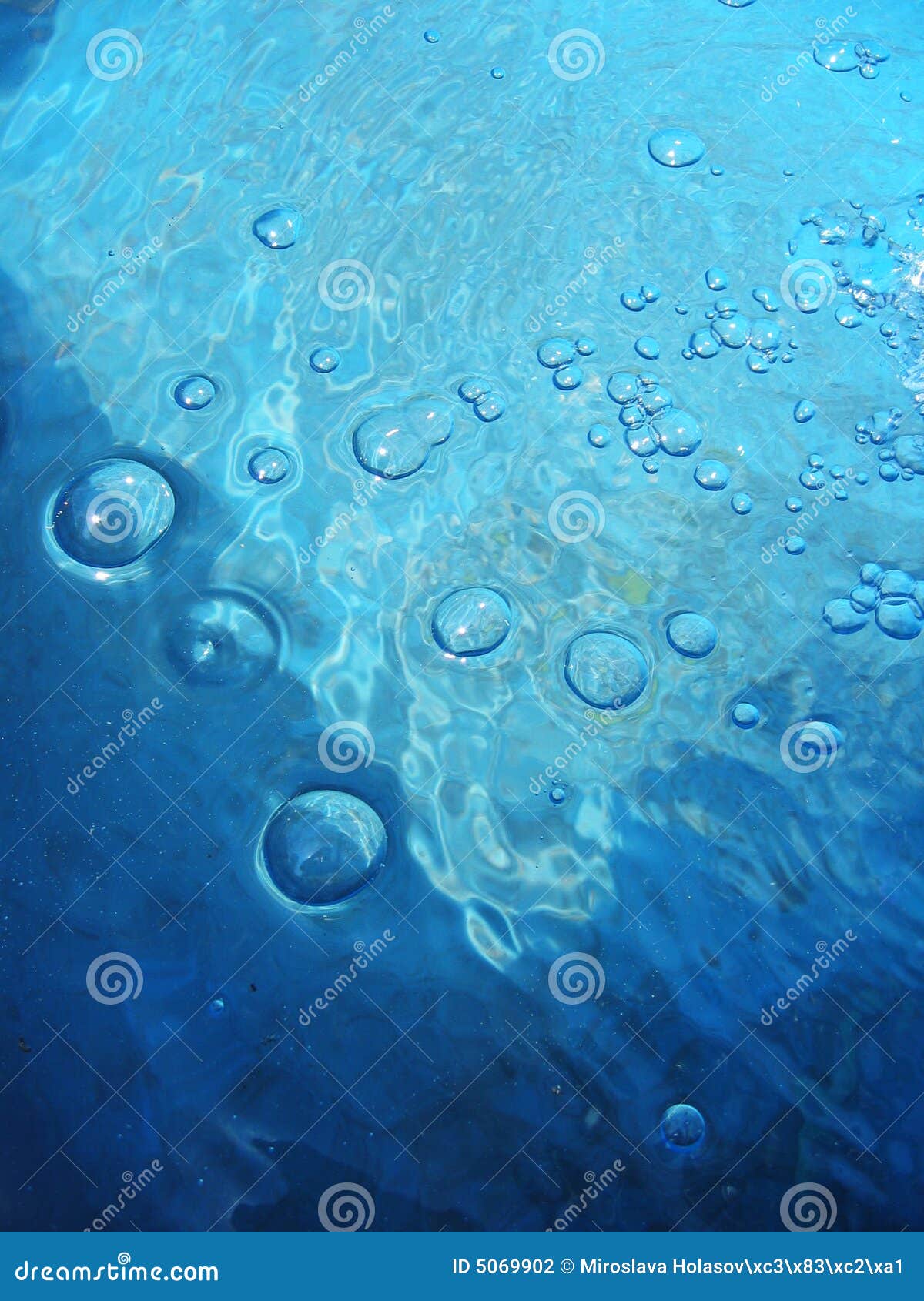 Bubbles on the water level stock photo. Image of surface - 5069902
