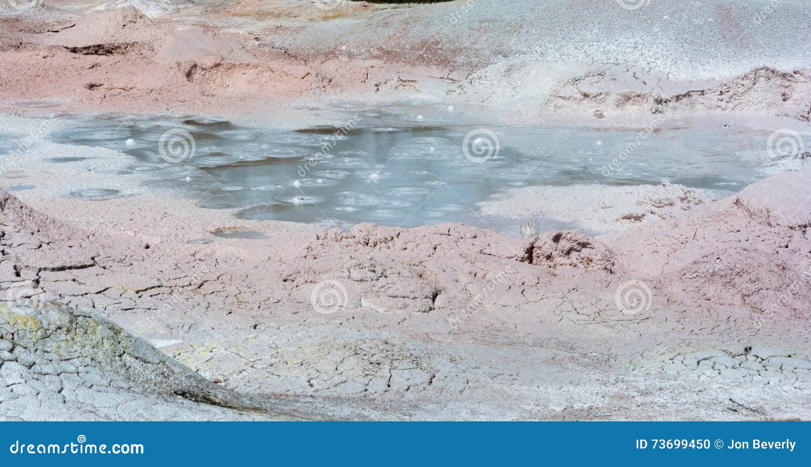 Bubbling mud pool stock photo. Image of yellow, stone - 73699450