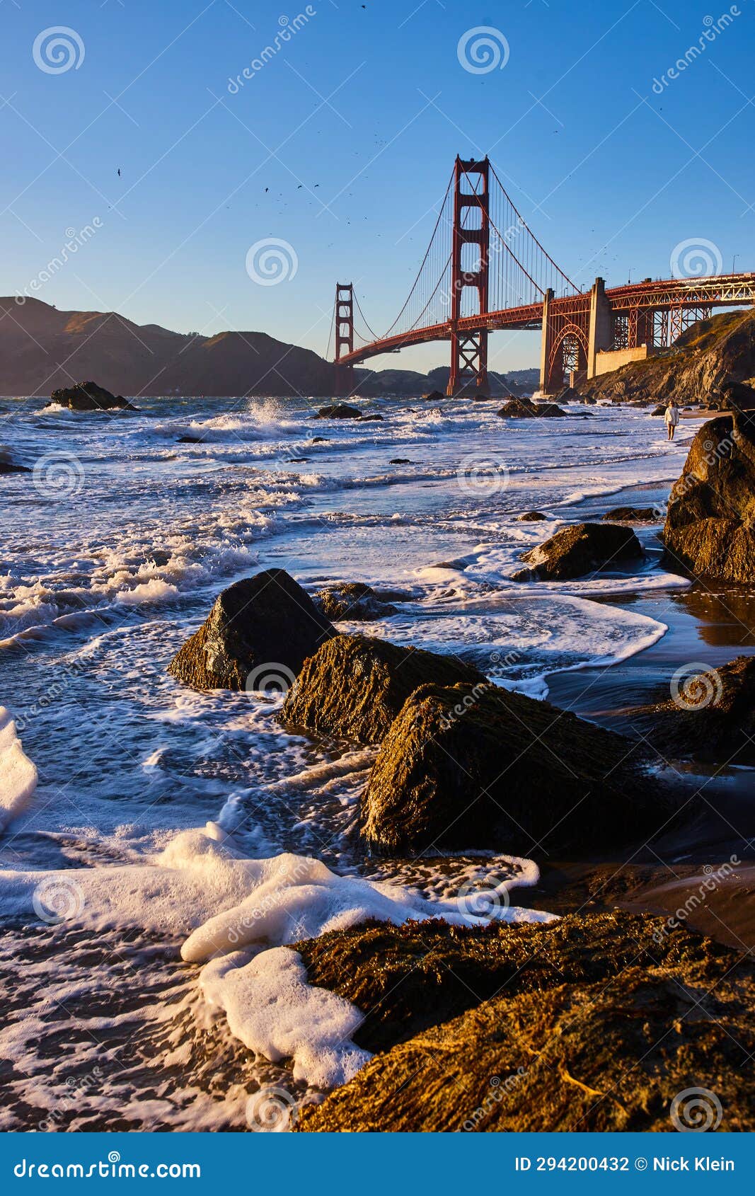 Bubbling Seafoam on Shore with Sunset Striking Golden Gate Bridge from ...
