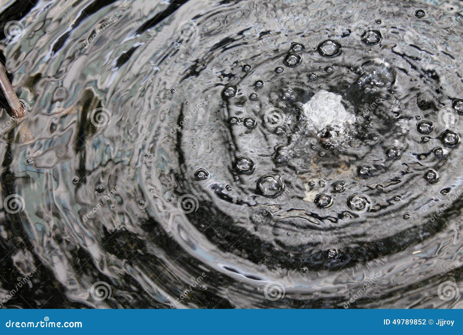 Bubbling Water Fountain with Bubbles and Ripples Stock Photo - Image of ...