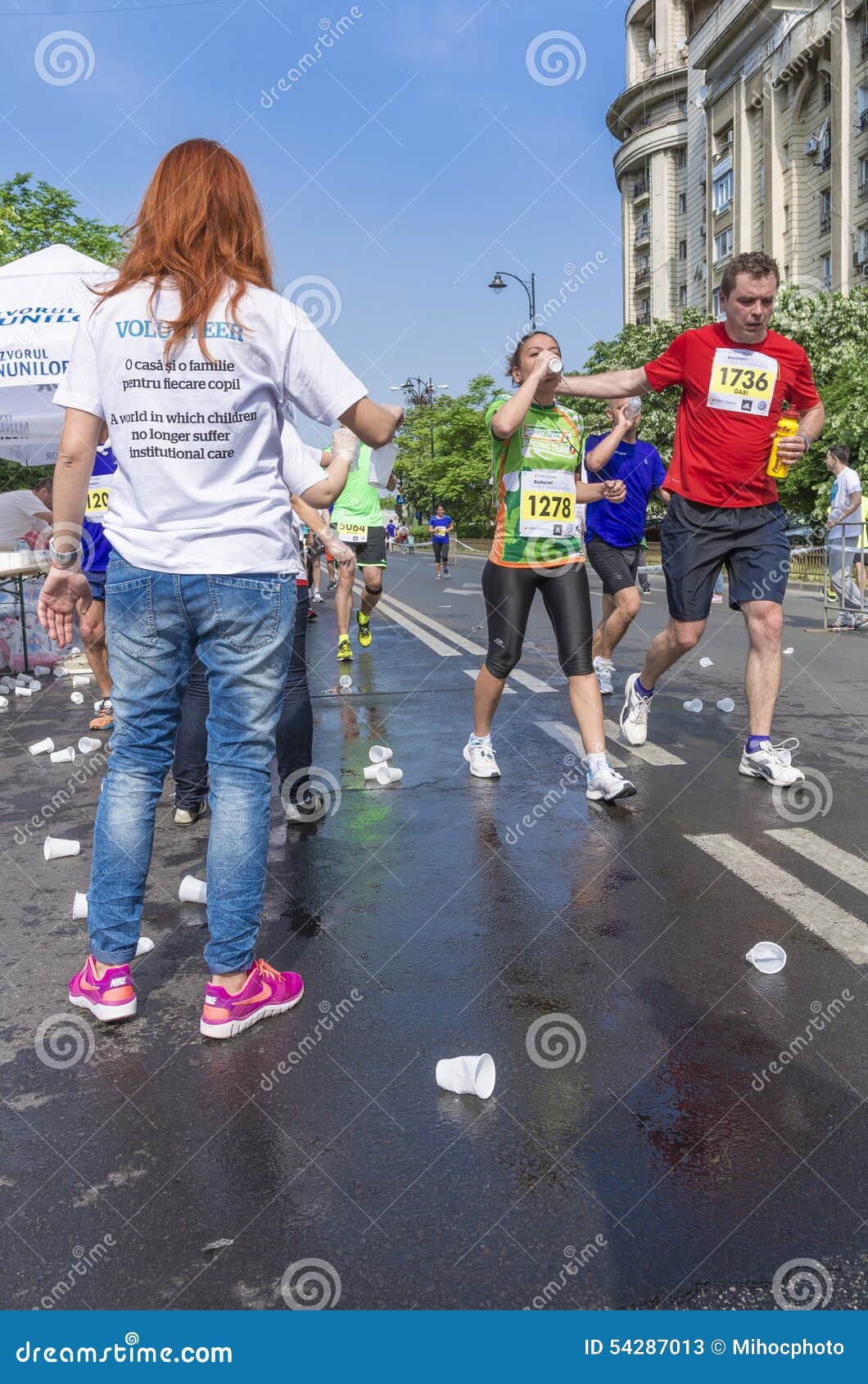 Runners Take a Water in a Marathon Race Editorial Stock Photo - Image ...