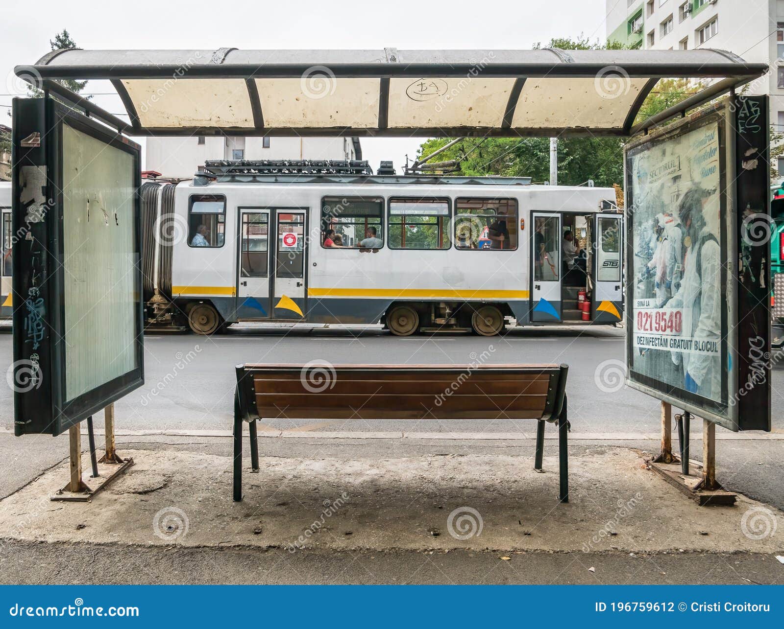 Bucharest/Romania - 09.03.2020: Bench on a Bus Station and a Tram ...