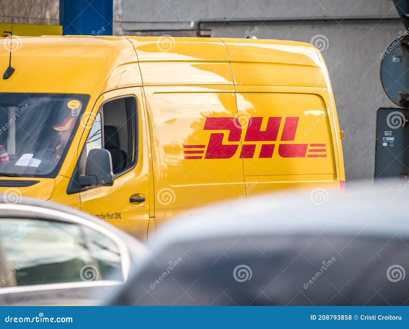 DHL International Courier Van in Traffic on the Streets of Bucharest ...