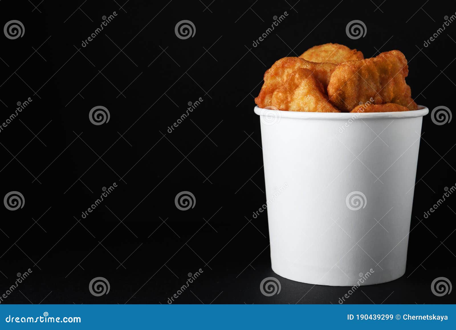 Bucket with Delicious Chicken Nuggets on Background. Space for Text ...