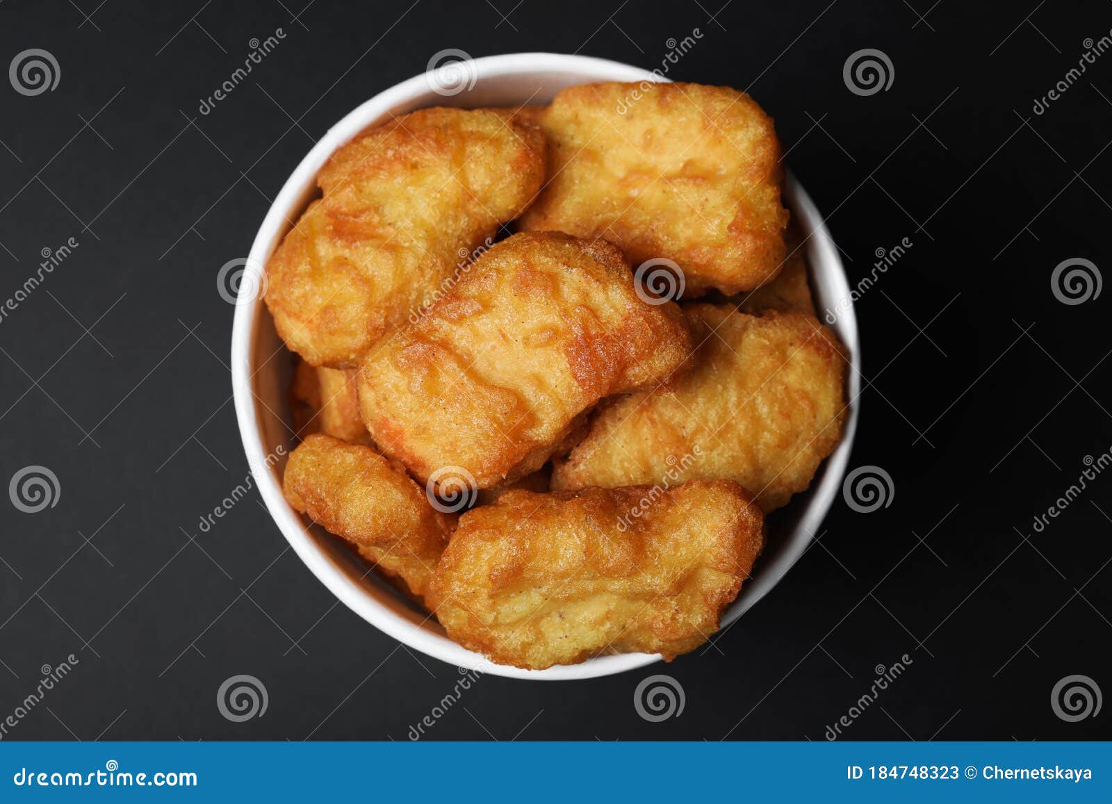 Bucket with Delicious Chicken Nuggets on Background, Top View Stock ...