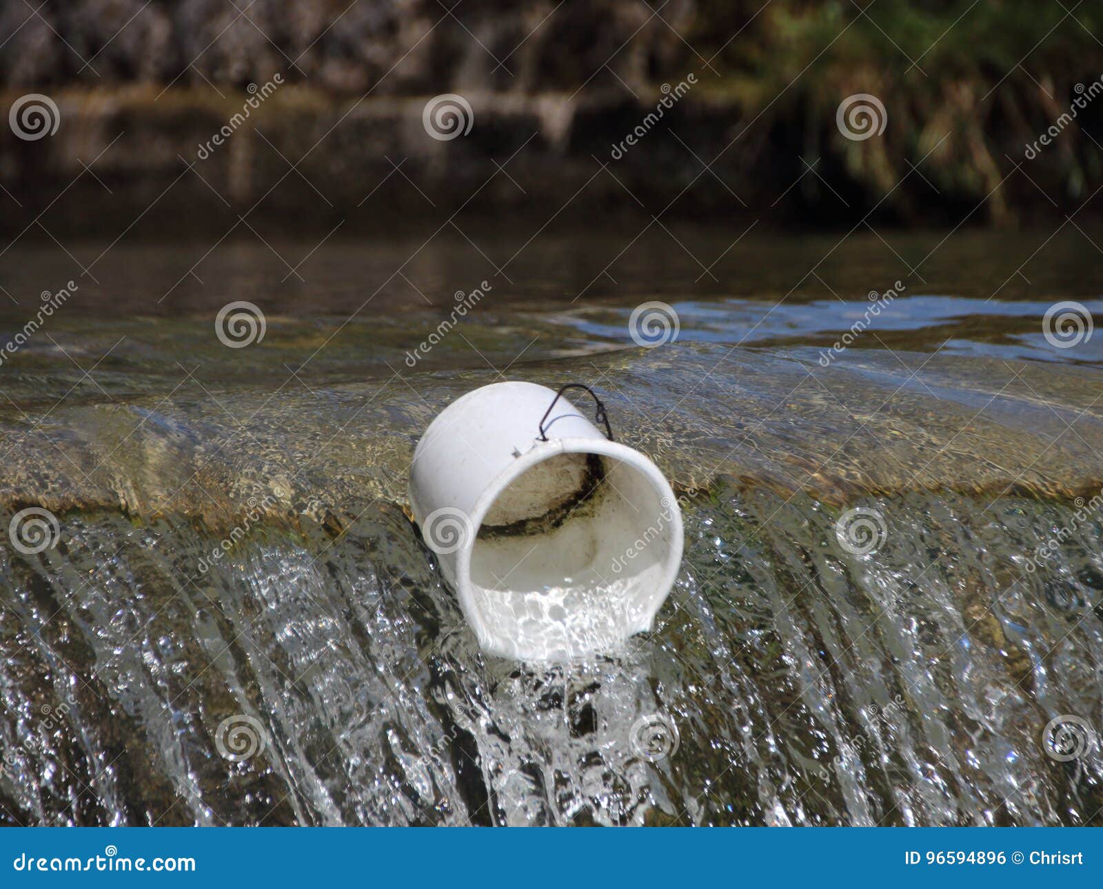 Bucket in Drain Canal with Melting Water from Mountains Stock Photo ...