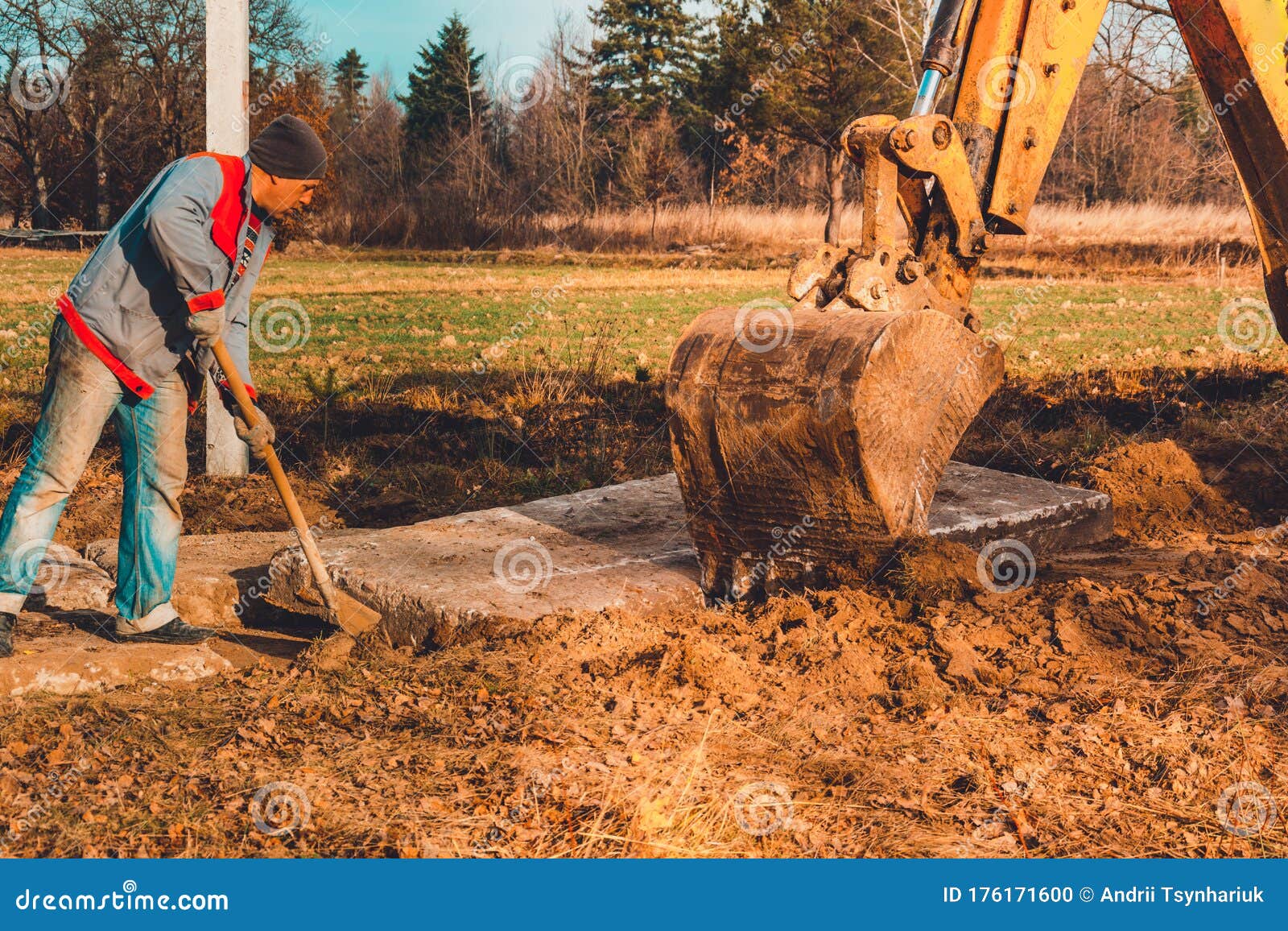 The Bucket Excavator Pulls Up Concrete Slabs To Set the Road Stock ...