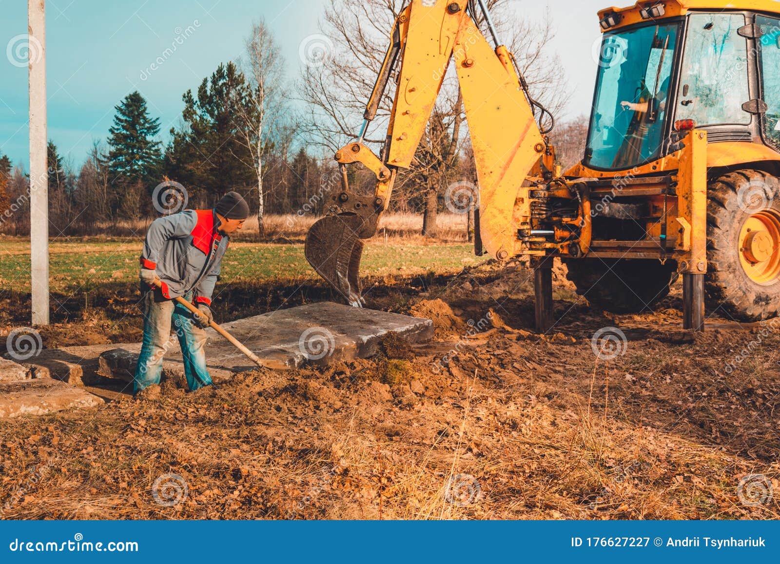 The Bucket Excavator Pulls Up Concrete Slabs To Set the Road Stock ...