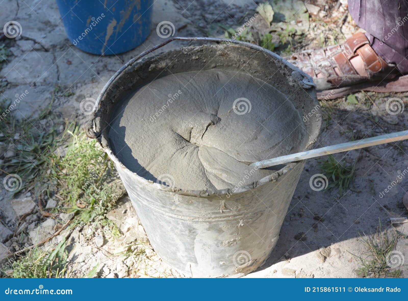 A Bucket with Mixed Cement Mortar on the Construction for Laying Bricks ...