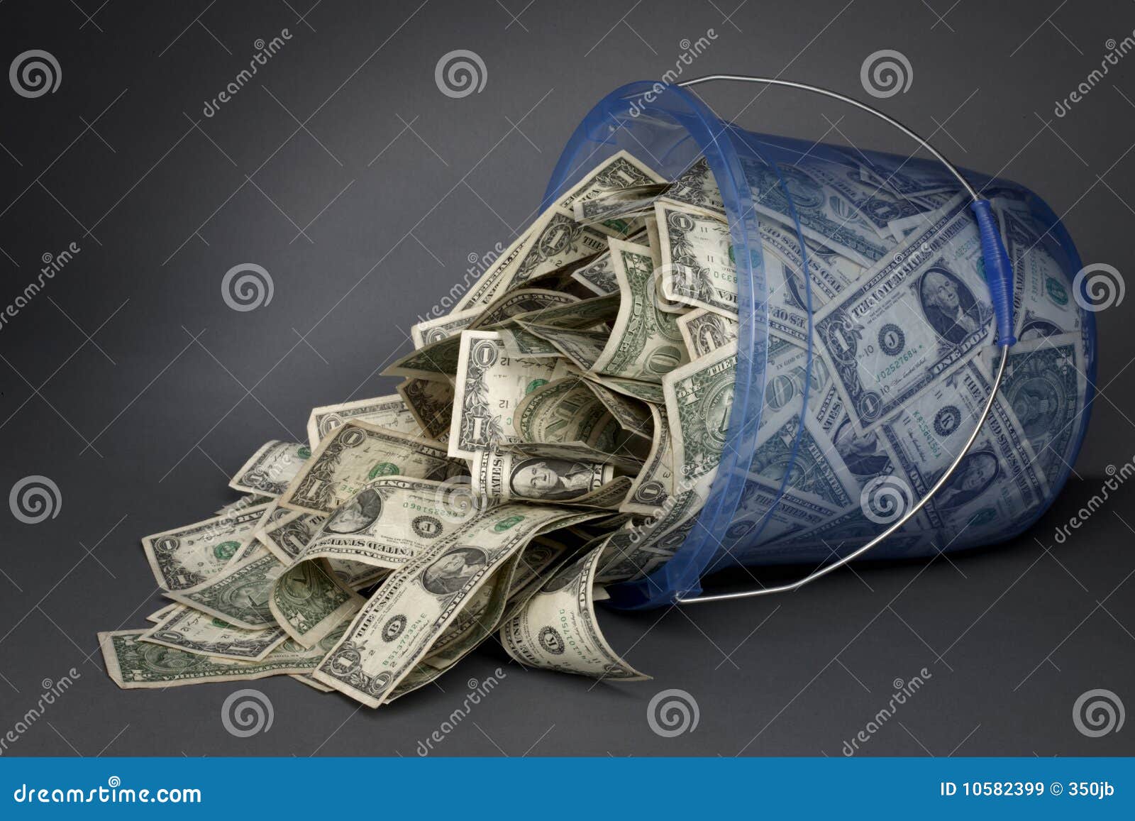 Bucket-O-Bucks empties out stock image. Image of bucket - 10582399