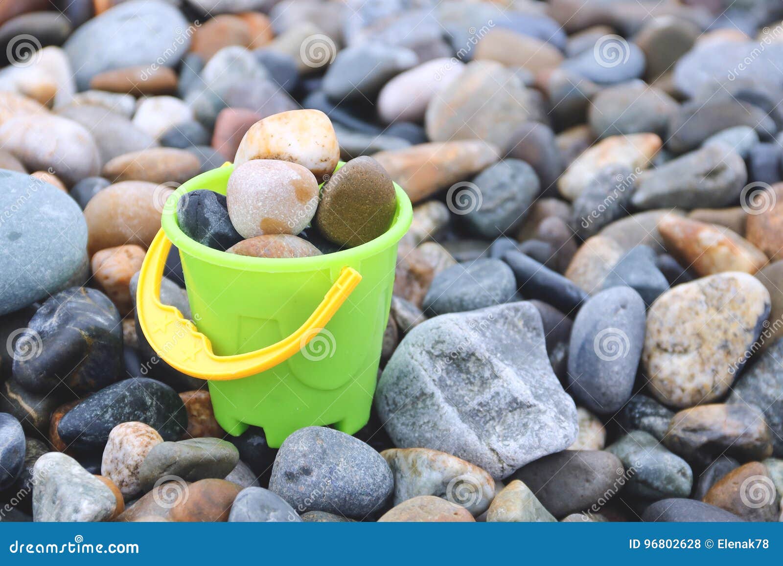 Bucket with pebbles stock photo. Image of overcast, summer - 96802628