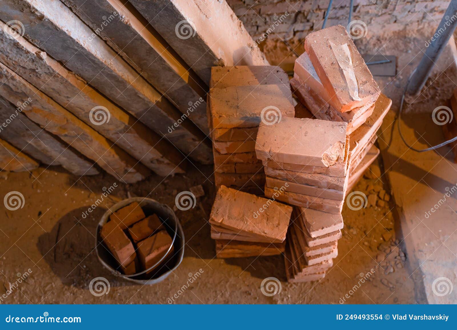 Bucket with Red Ceramic Bricks. Warehouse of Bricks at a Construction ...