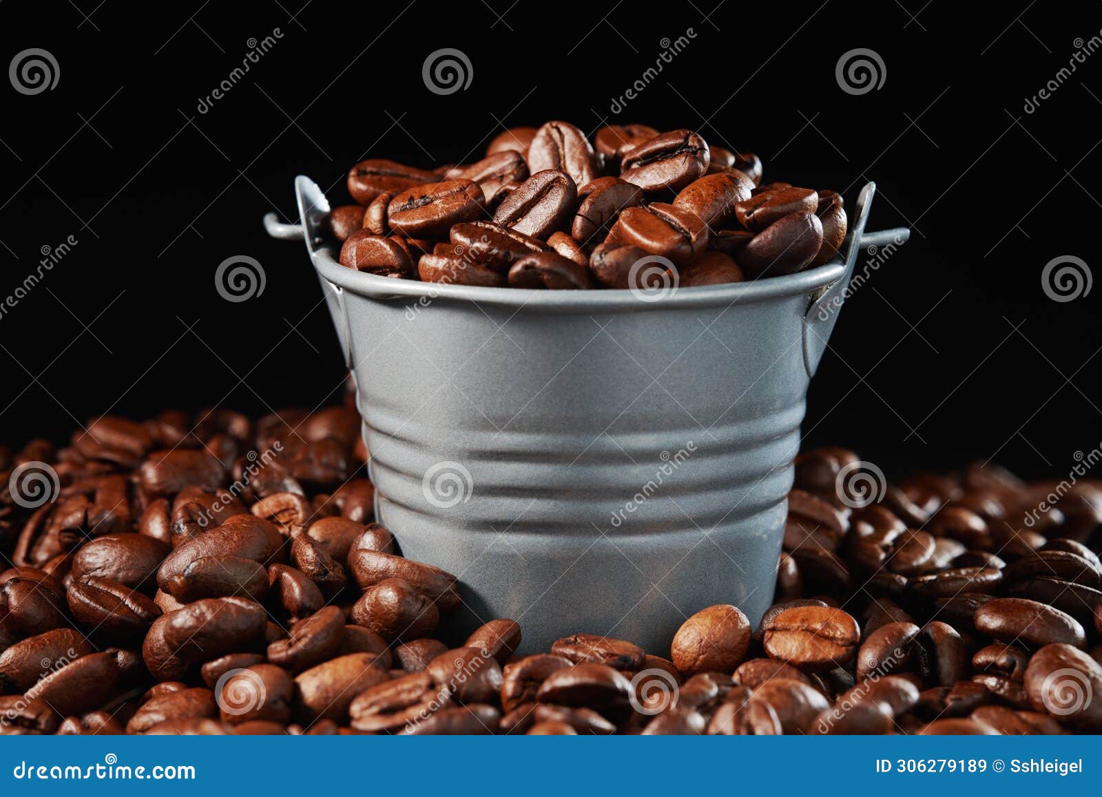 A Bucket of Roasted Coffee Beans in a Pile of Coffee Beans on a Black ...
