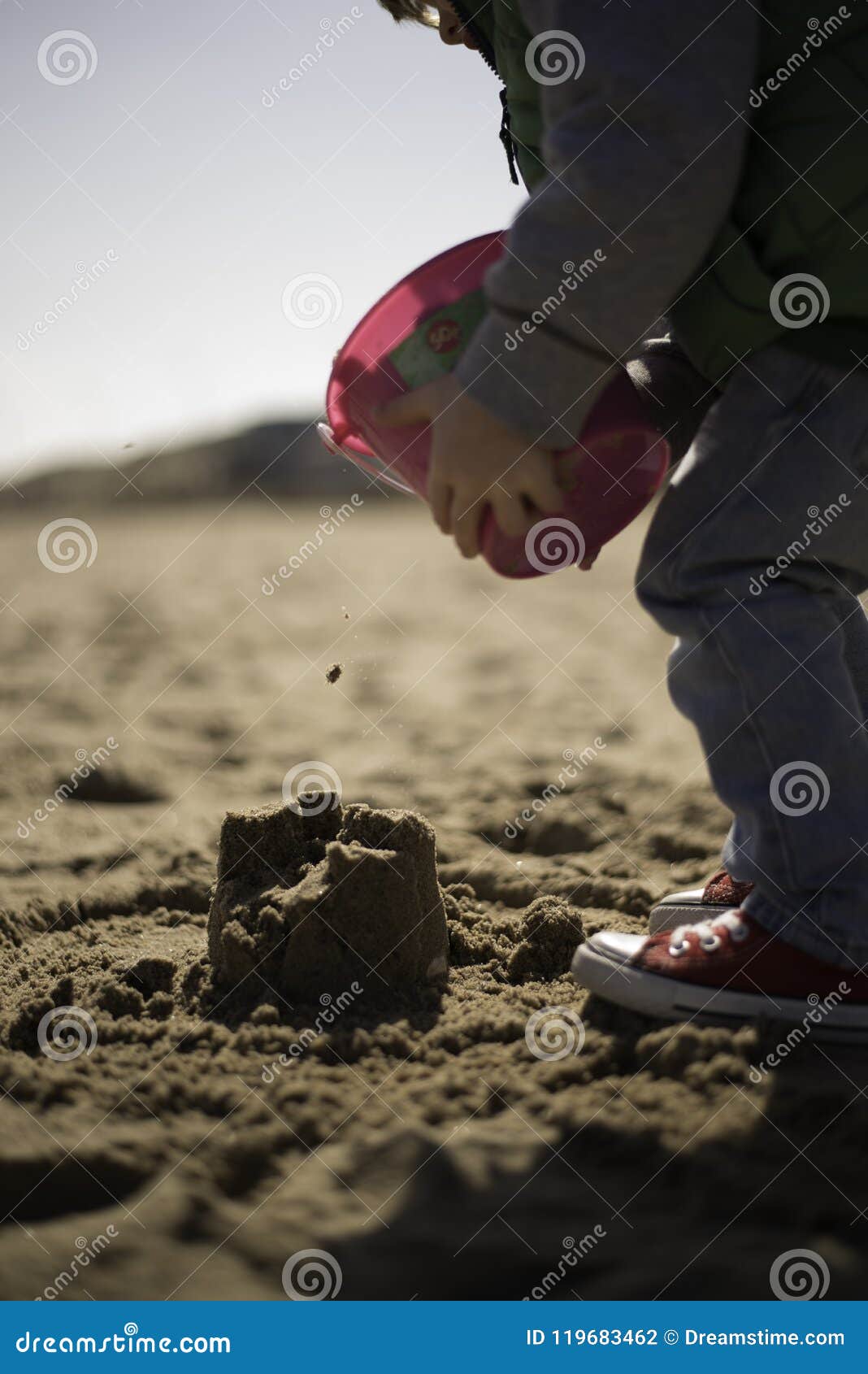 Bucket and sandcastle stock photo. Image of head, back - 119683462