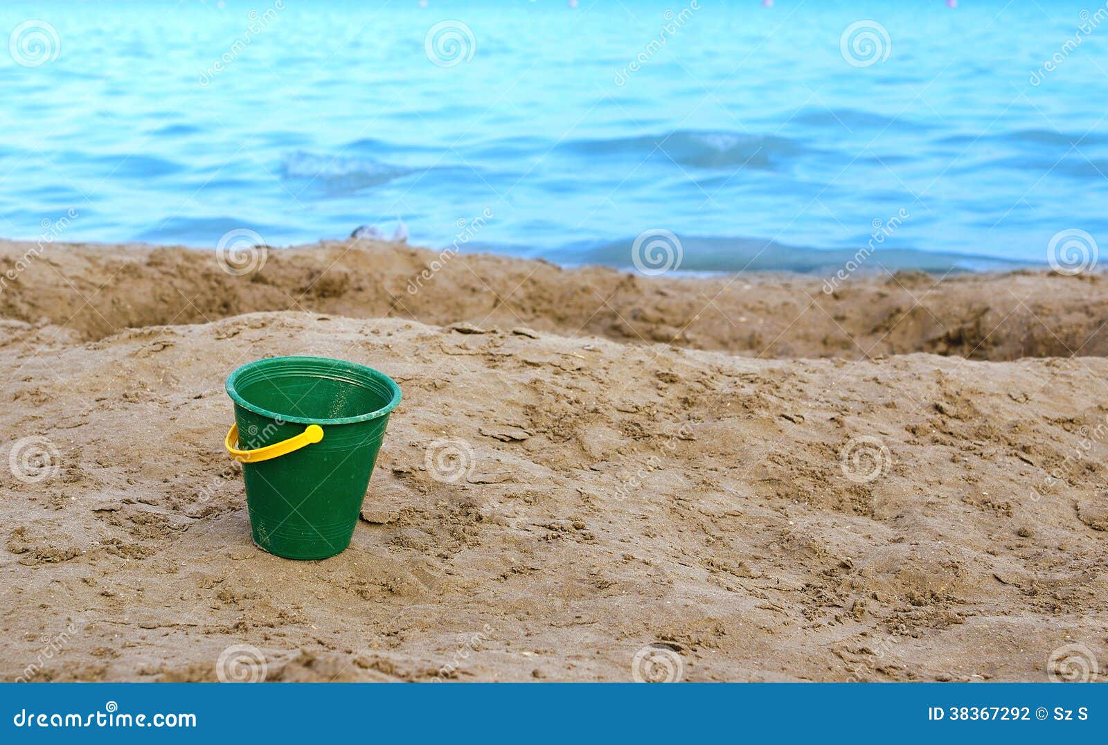 Bucket on the sandy beach stock photo. Image of vacation - 38367292