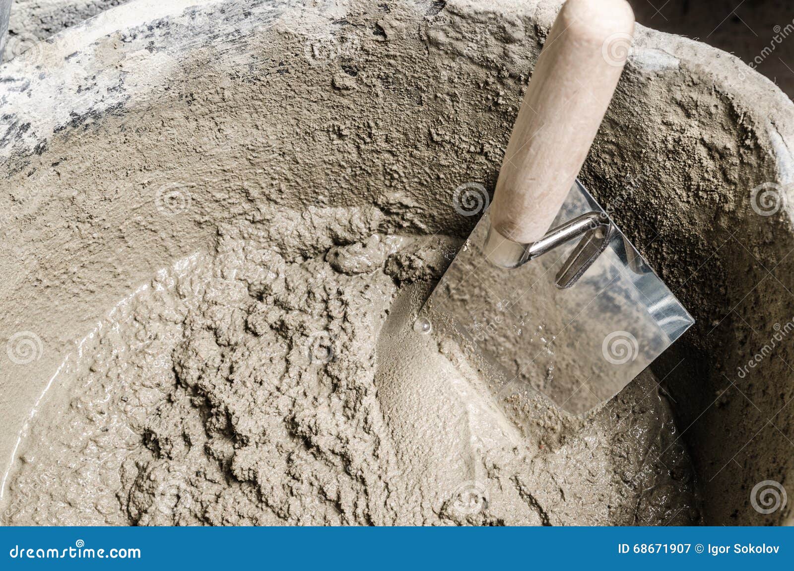 Bucket With A Solution. Knead The Solution With A Mixer In A Bucket Of ...