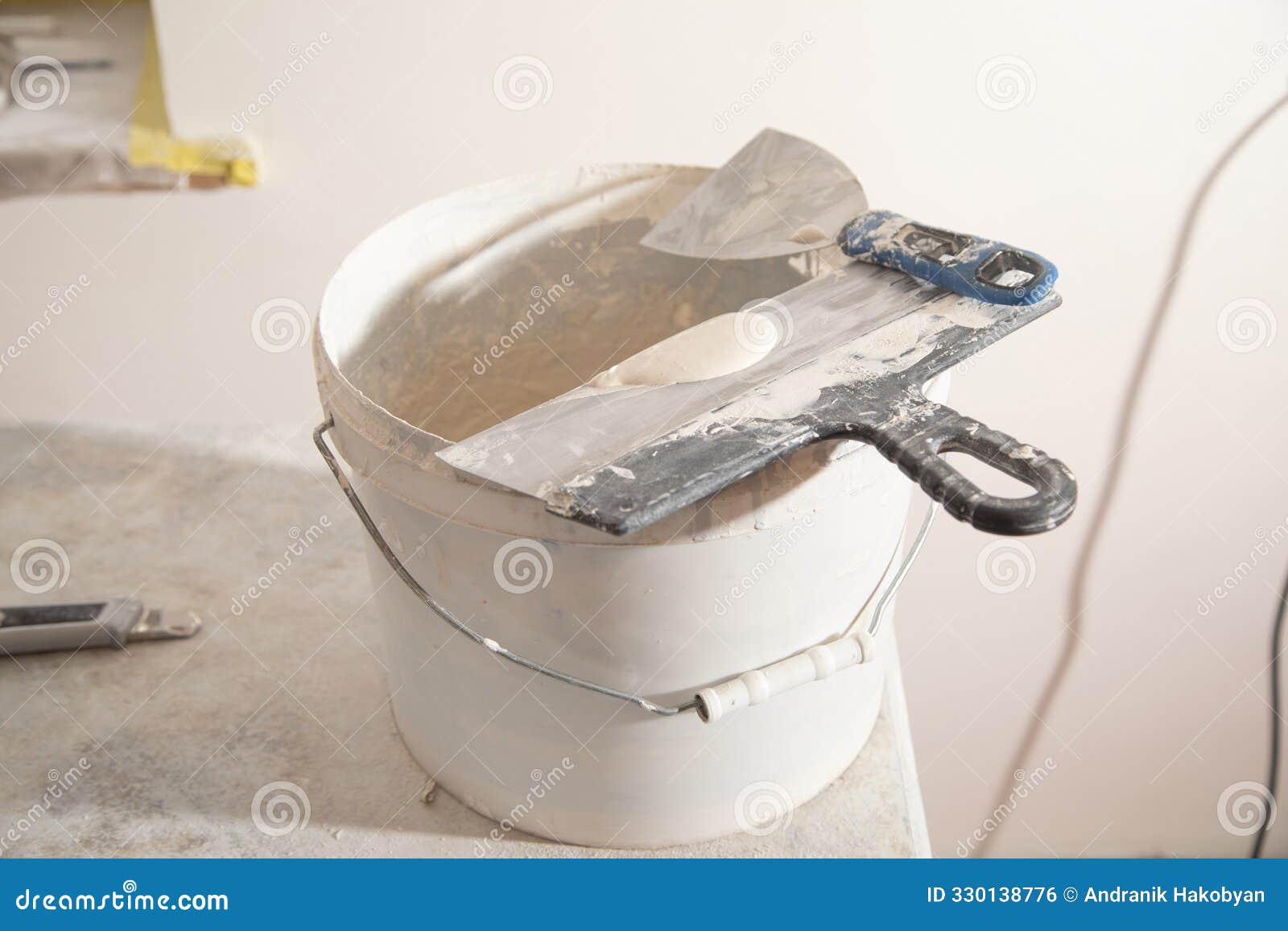 Bucket with a Spatula for Leveling Stock Photo - Image of building ...